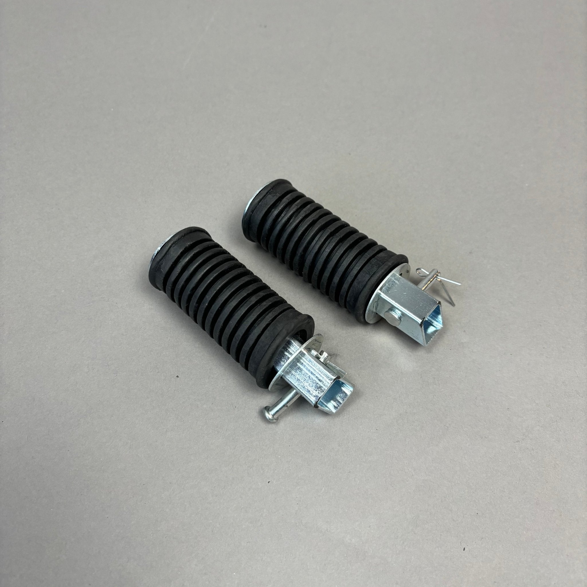 Passenger footrests for e-mopeds or e-scooters.